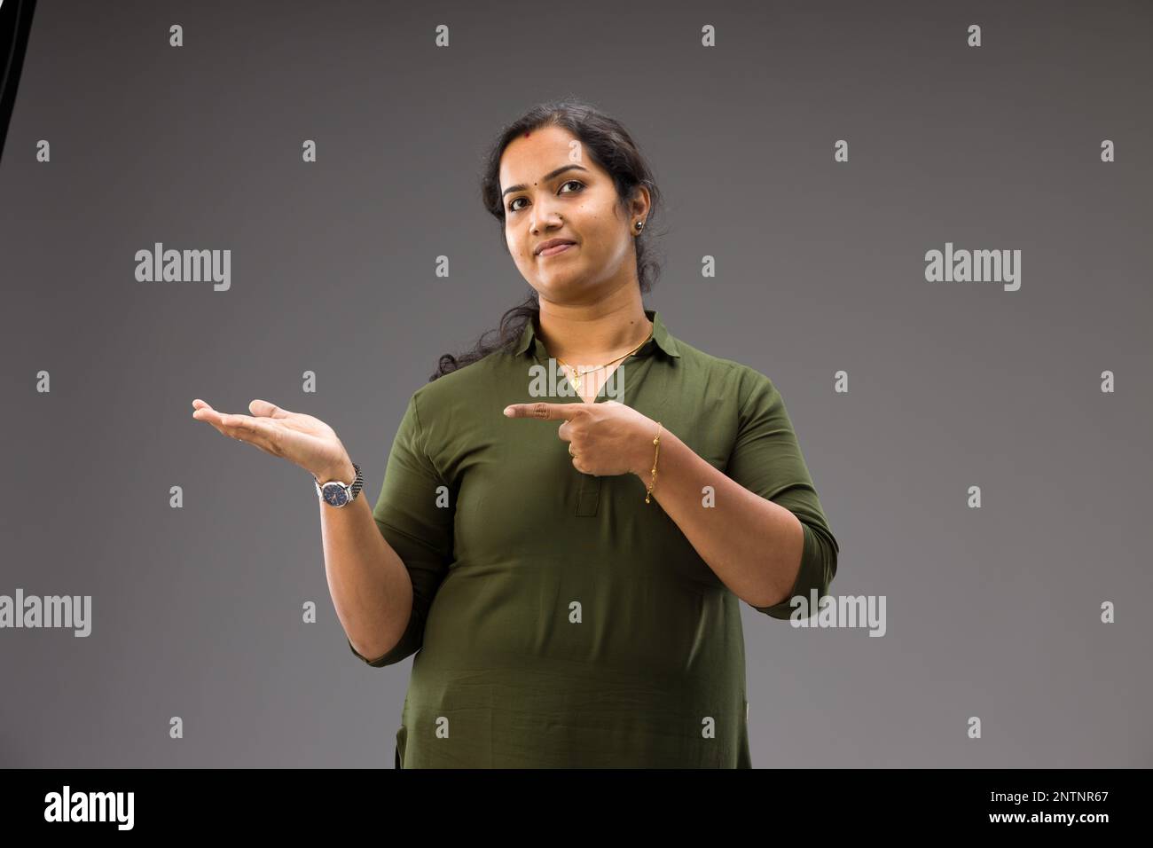 Portrait of an Indian woman,Standing pose showing different gesters ...