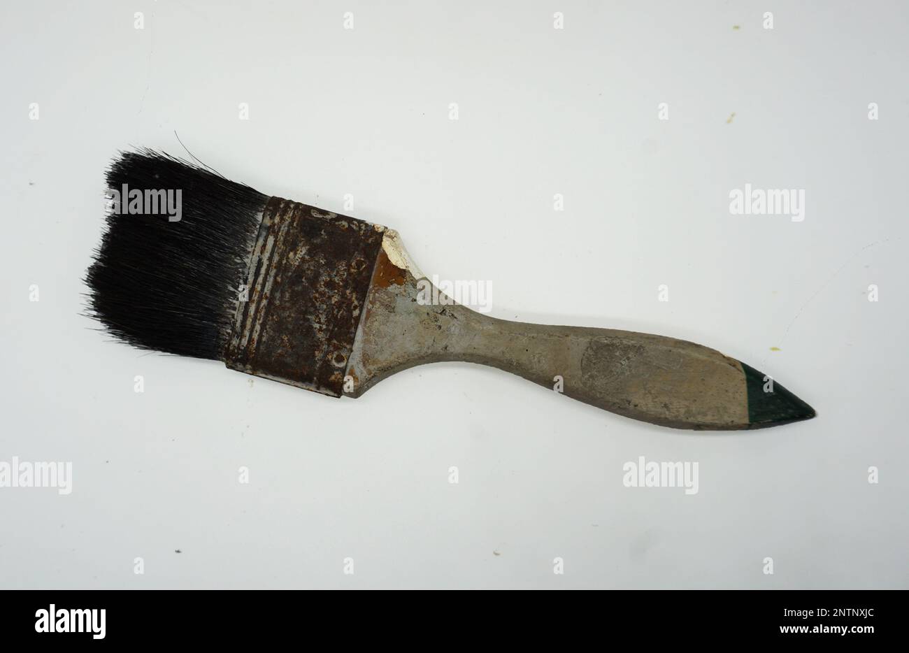 The old rusty paintbrush has been used for a long time Stock Photo - Alamy