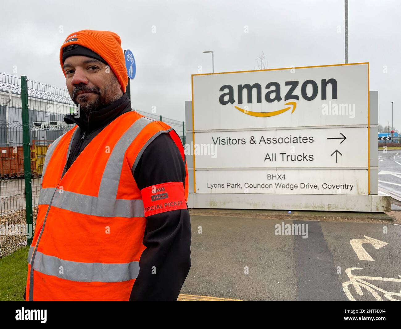 GMB union member Delcan Downes on the picket line outside the Amazon ...