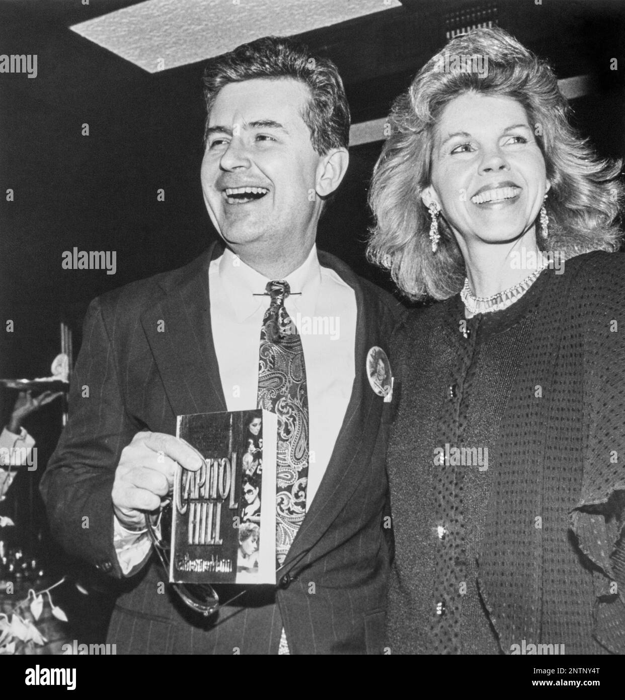 Rep. Fred Grandy R-Iowa holding wife's new book Capitol Hill and Catherine Mann smiling in 1992 ...