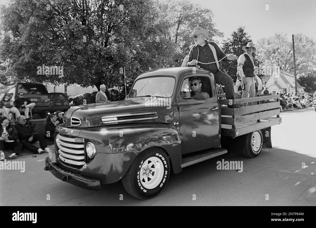 At the Madison County Covered Bridges Festival parade, people are seen ...