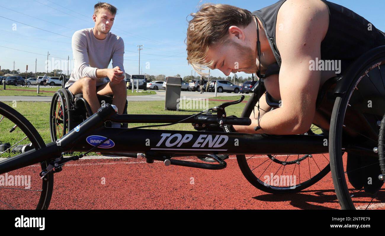 Tripp Davis, left, sits in his friend Jack Massey's wheelchair as ...