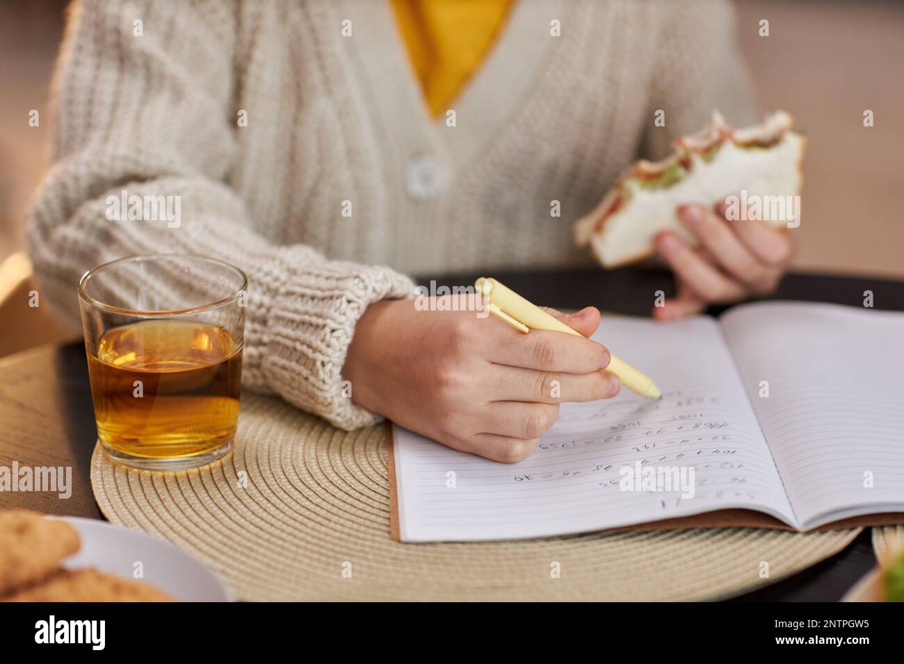 Teen girl doing homework sitting hi-res stock photography and images ...