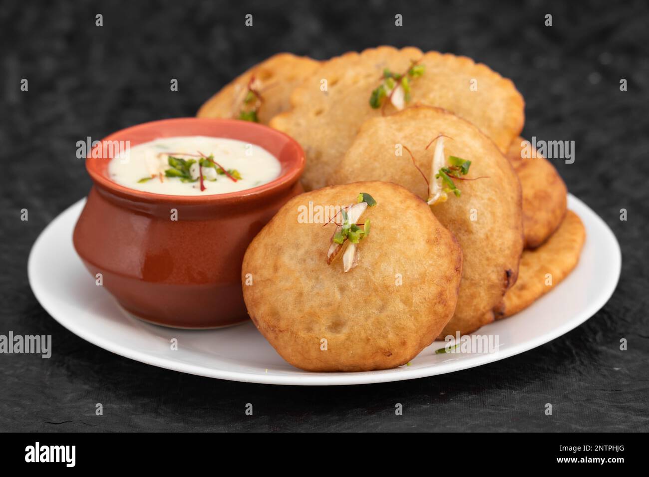 Traditional Indian Malpua, Pua Or Pooa Served With Lachhedar Malai ...