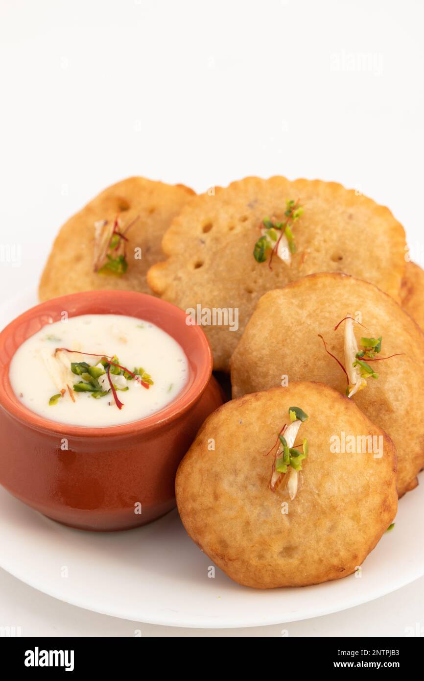 Traditional Indian Malpua, Pua Or Pooa Served With Lachhedar Malai ...