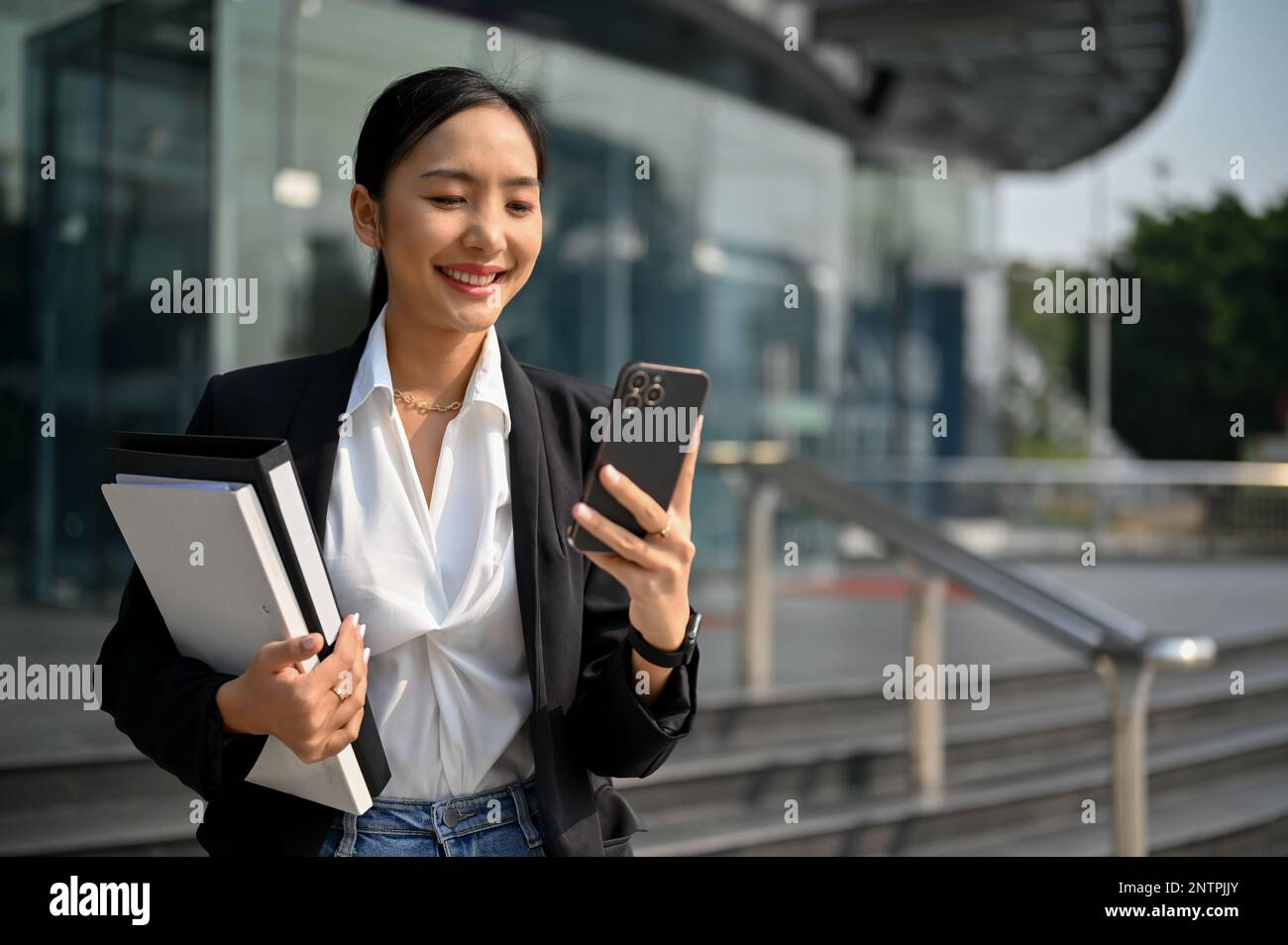 Successful and confident millennial Asian businesswoman or female CEO ...