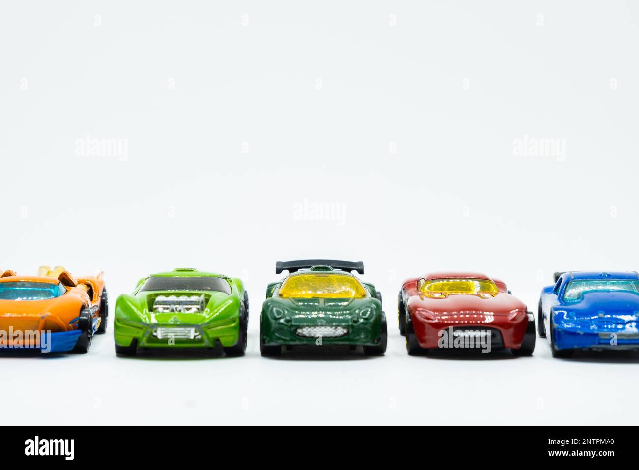 Miniature and game. Colorful racing cars with a white background Stock ...