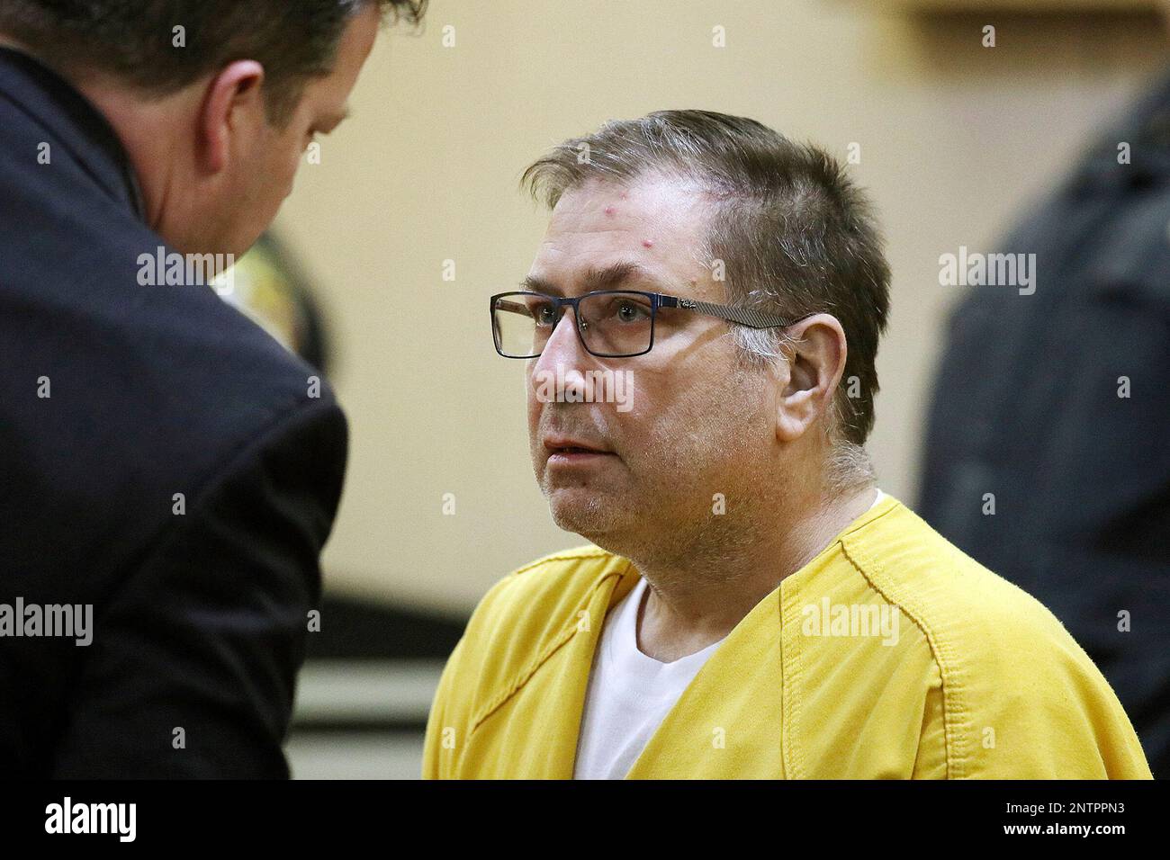 Paul Caneiro speaks to Michael Wicke, deputy assistant public defender ...