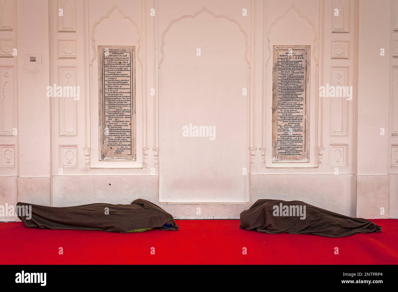 Pilgrims sleeping, after a hard trip, inside of Golden temple, Amritsar ...