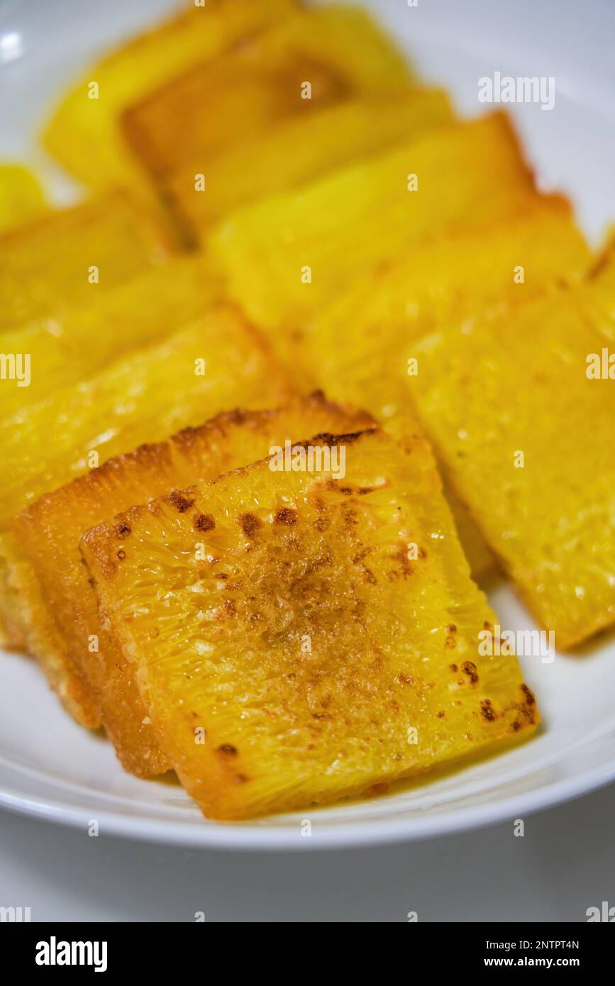 A plate of sweet and delicious Southeast Asian snacks, fried Indonesian ...