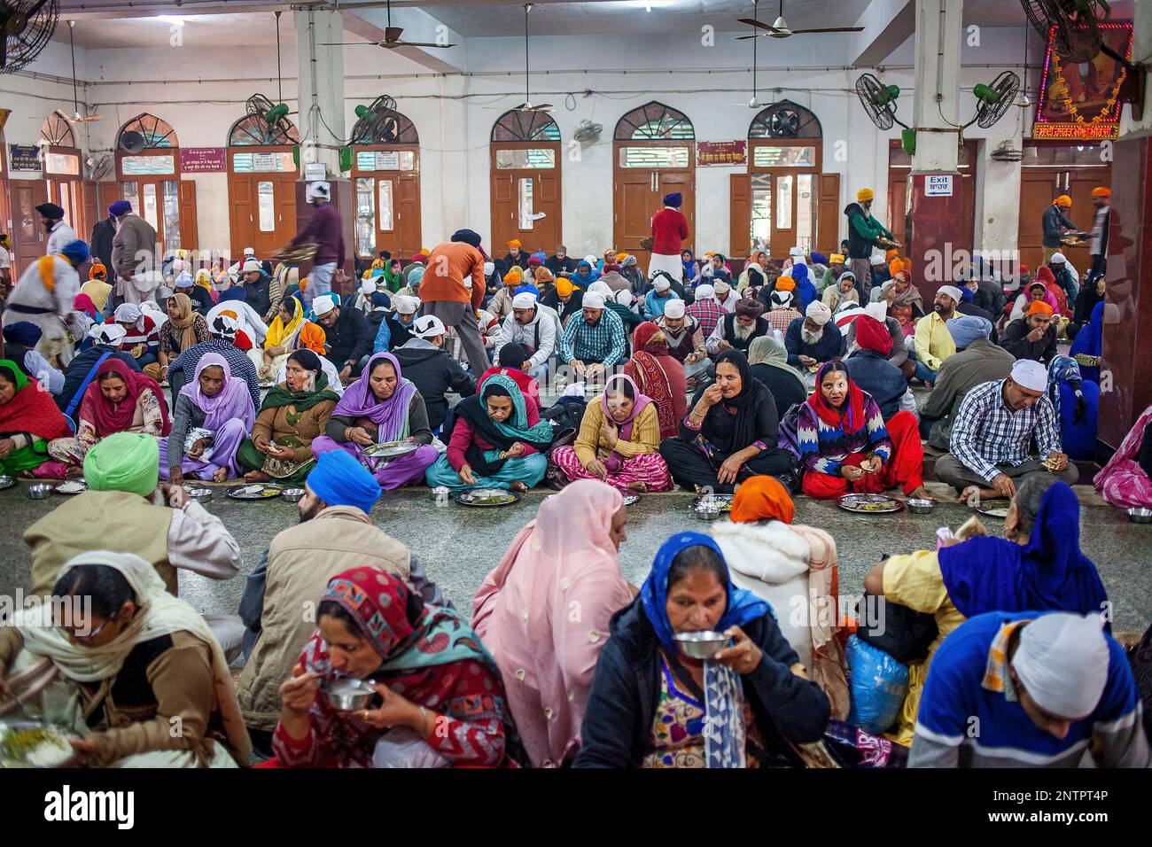 Pilgrims eating in the dinning room of Golden Temple, Each day the ...