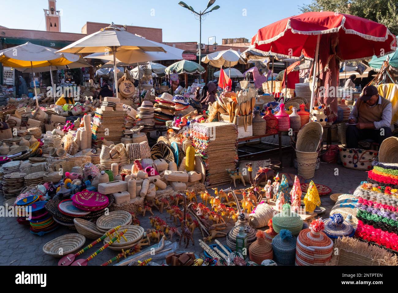 market stalls with typical straw products in the souk of Jemaa el-Fnaa ...