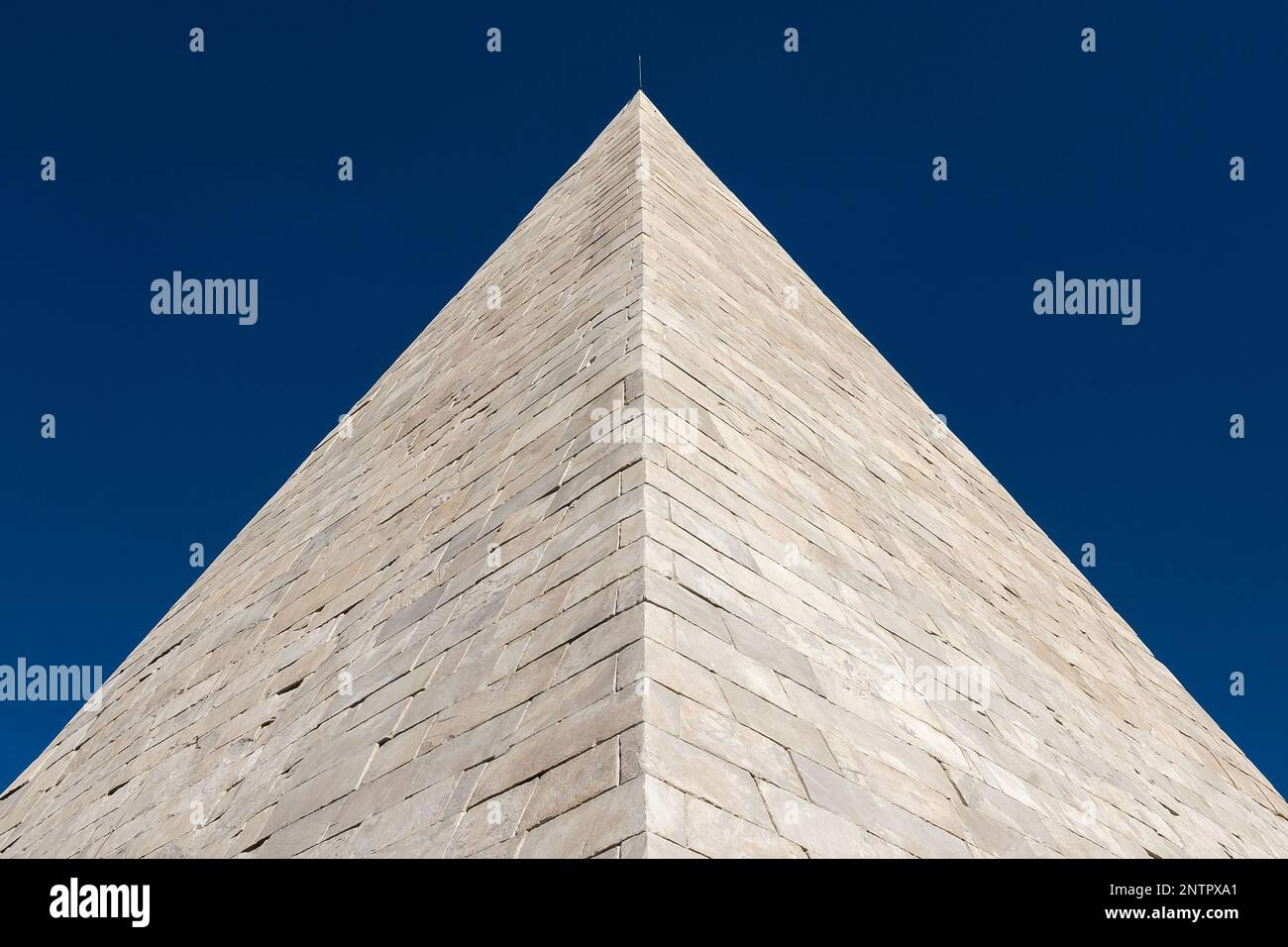 White marble Pyramid of Cestius, now part of Rome ancient walls ...