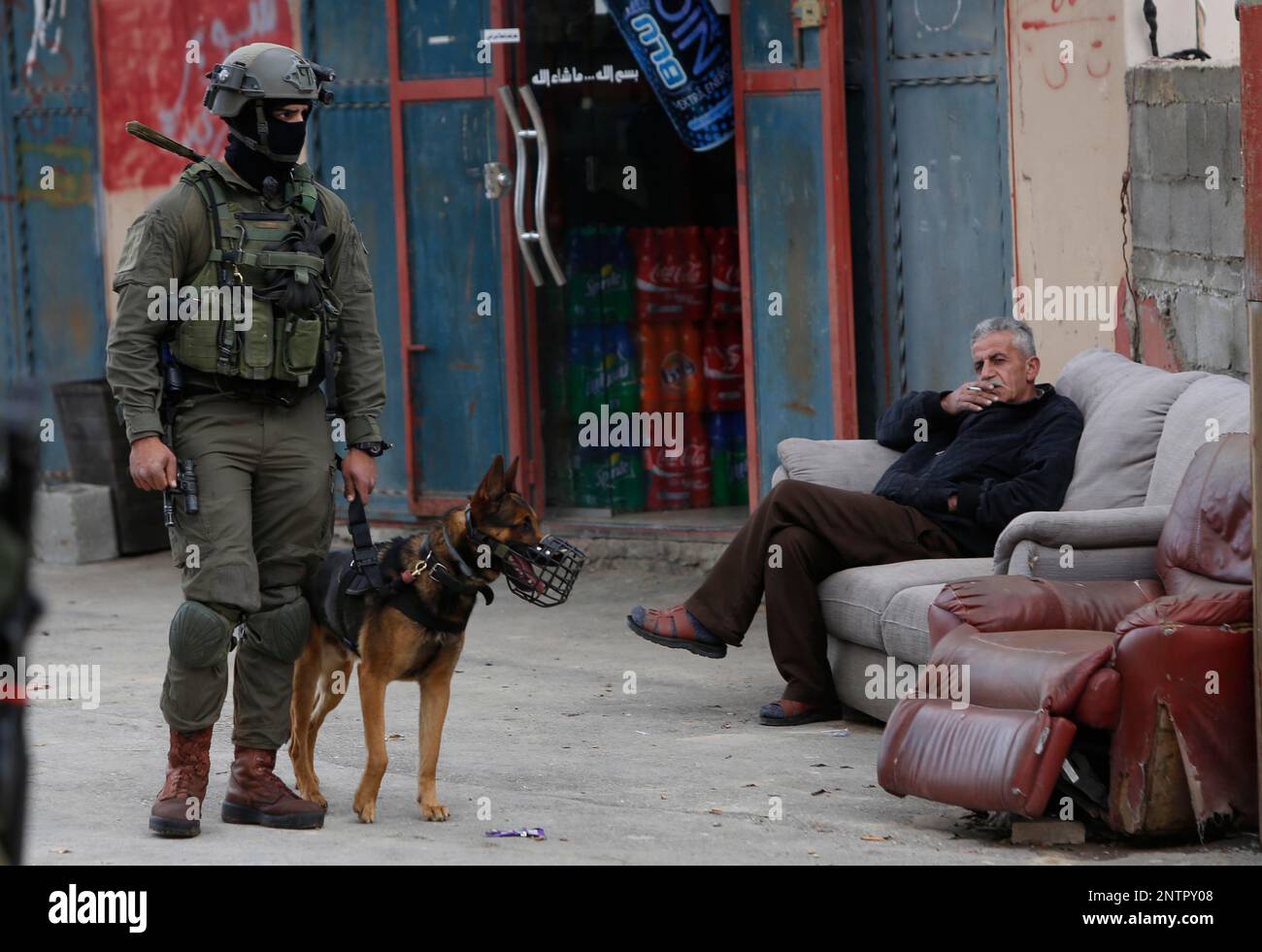 Israeli forces search for a Palestinian gunman in the village of Bruqin ...