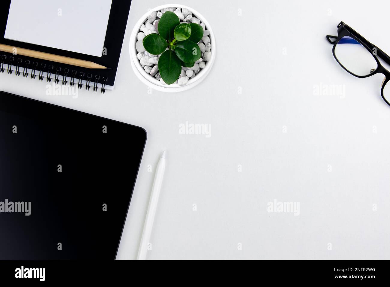 Top view of modern white desk with other devices in office on white ...