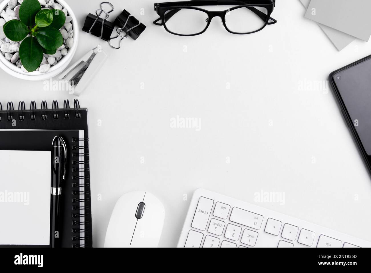 Top view of modern white desk with other devices in office on white ...