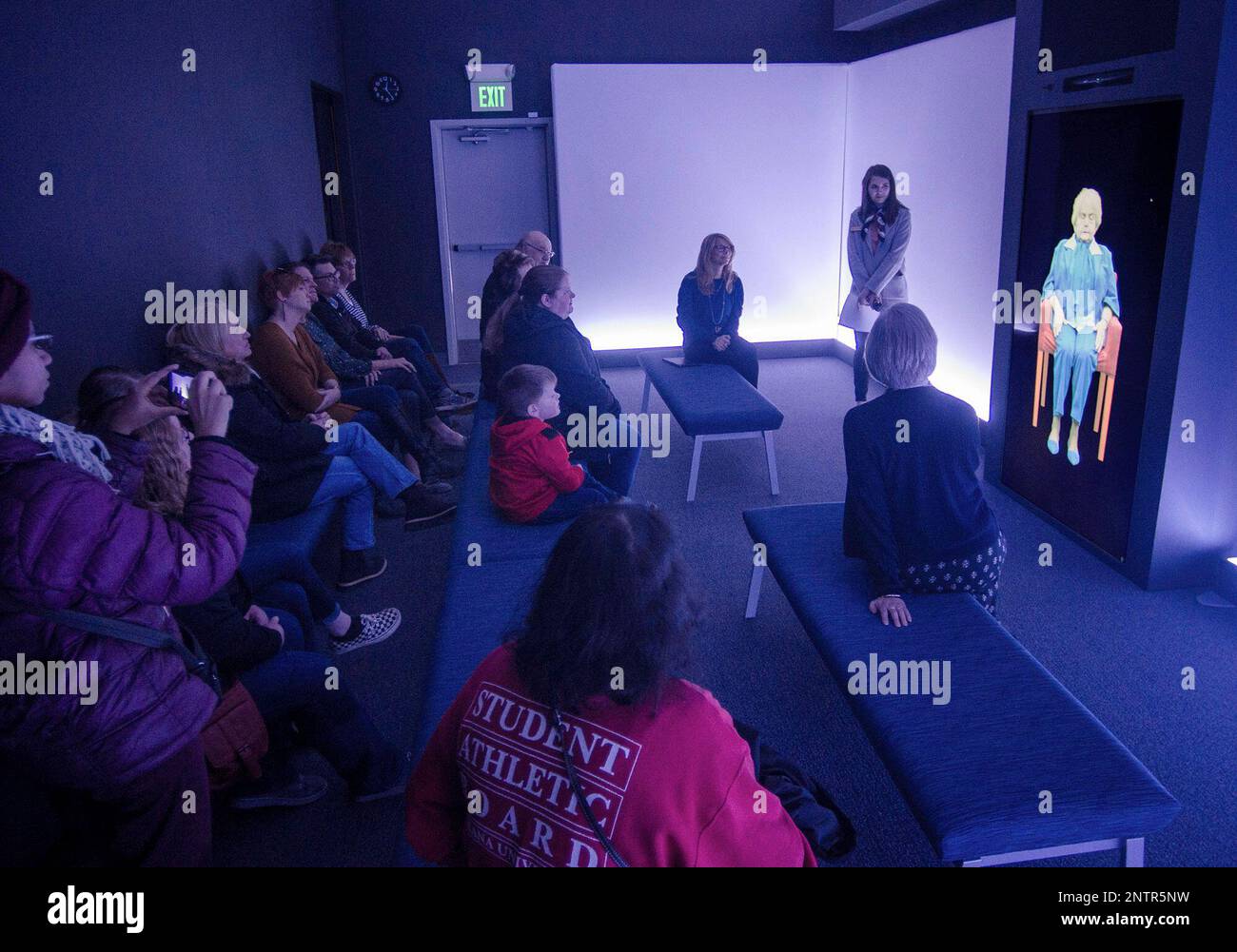 In this Sunday, March 10, 2019 photo, Brittani Logsdon, right standing ...