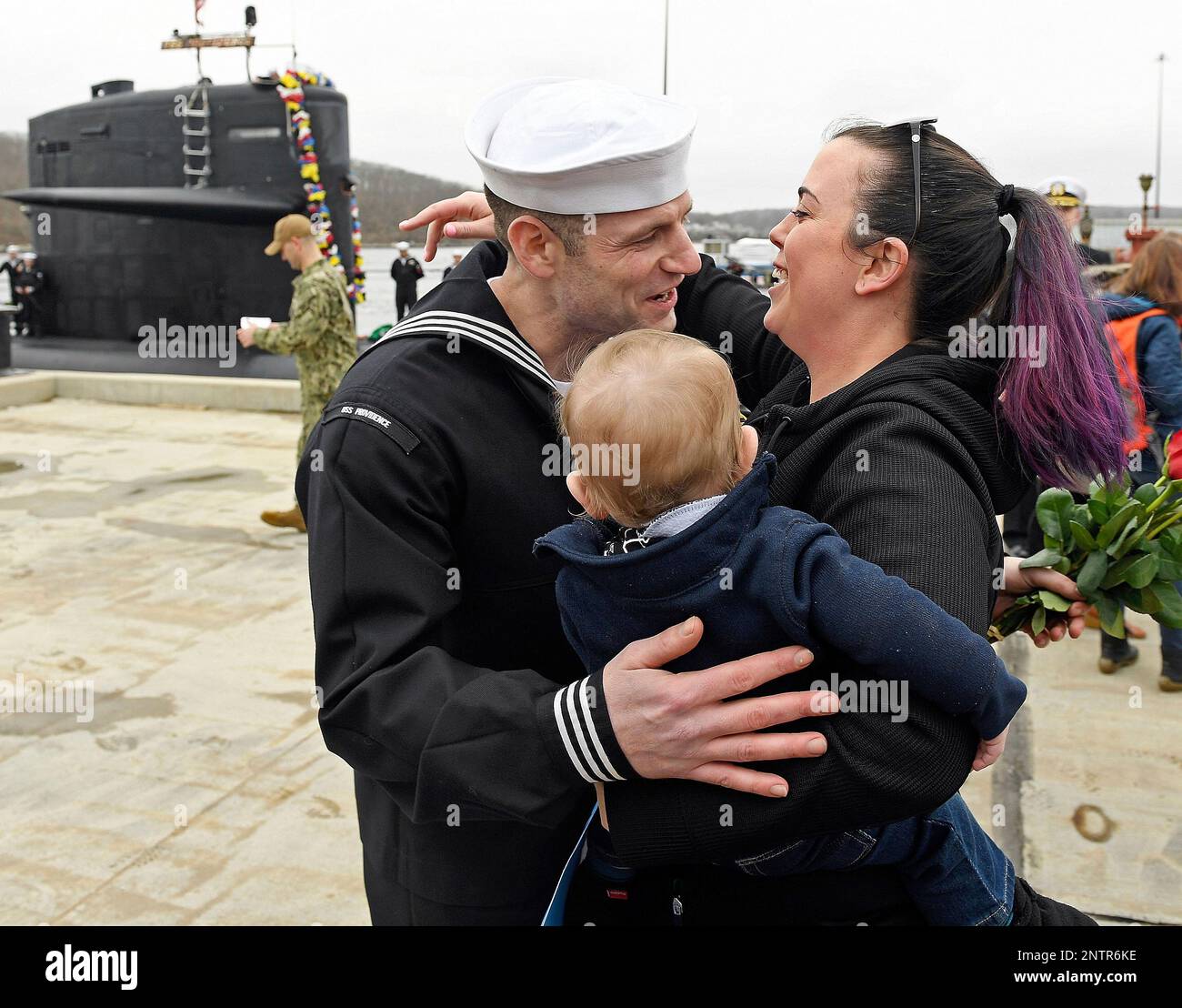 Petty officer first class Frederick James Chard, IV, greets his wife ...