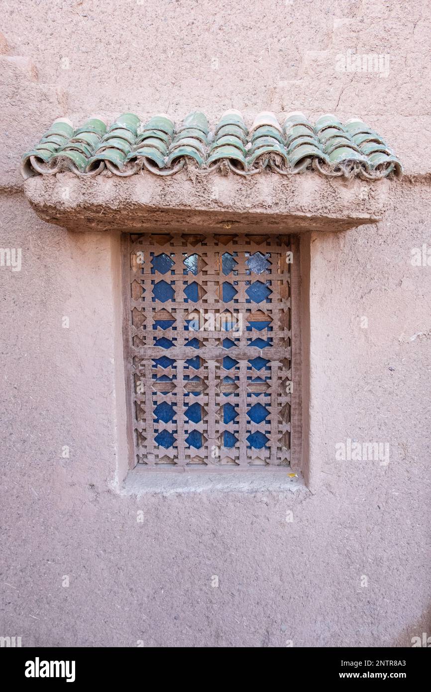 Ancient window on a back wall of a house in a barbarian village in the ...