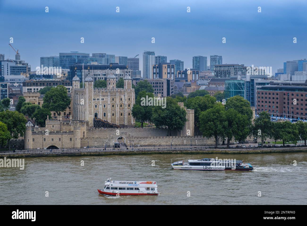Facing North across The River Thames with boats & the Tower of London ...