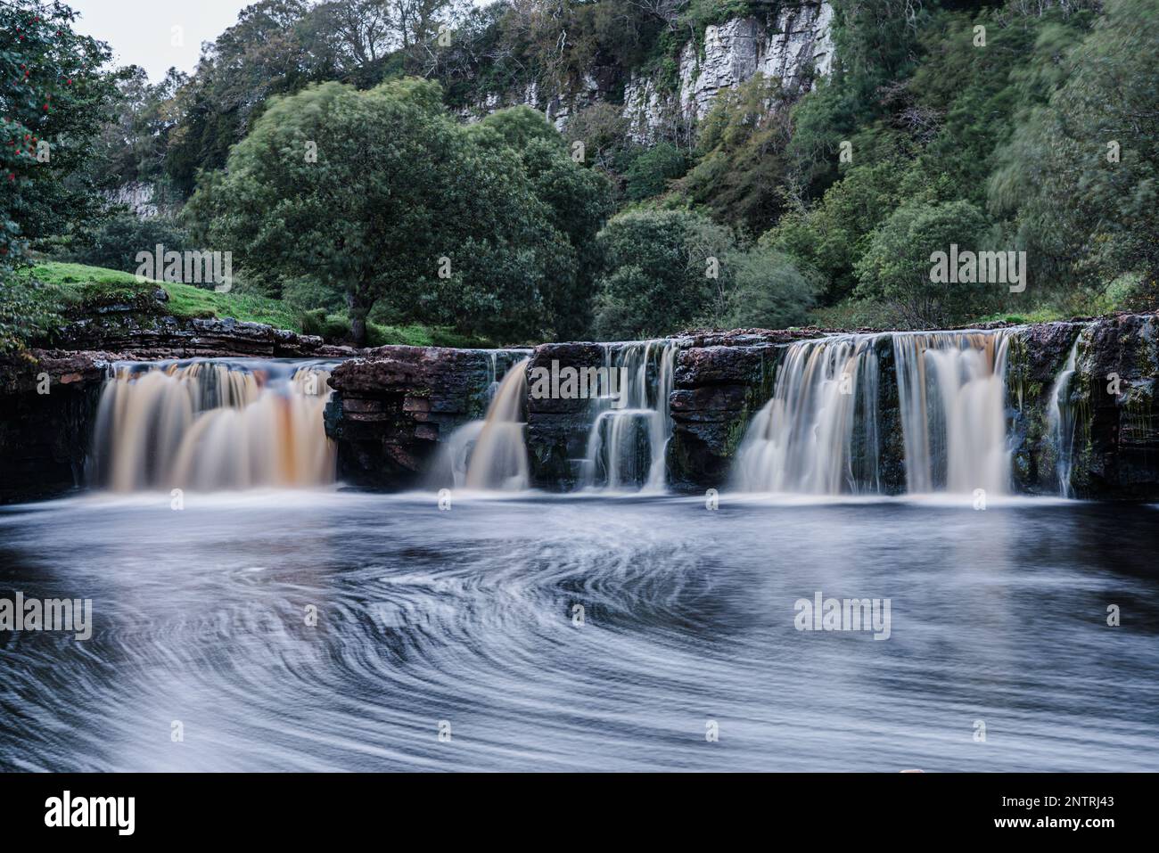 Waterfalls in the Yorkshire Dales countryside. Long exposure to produce ...