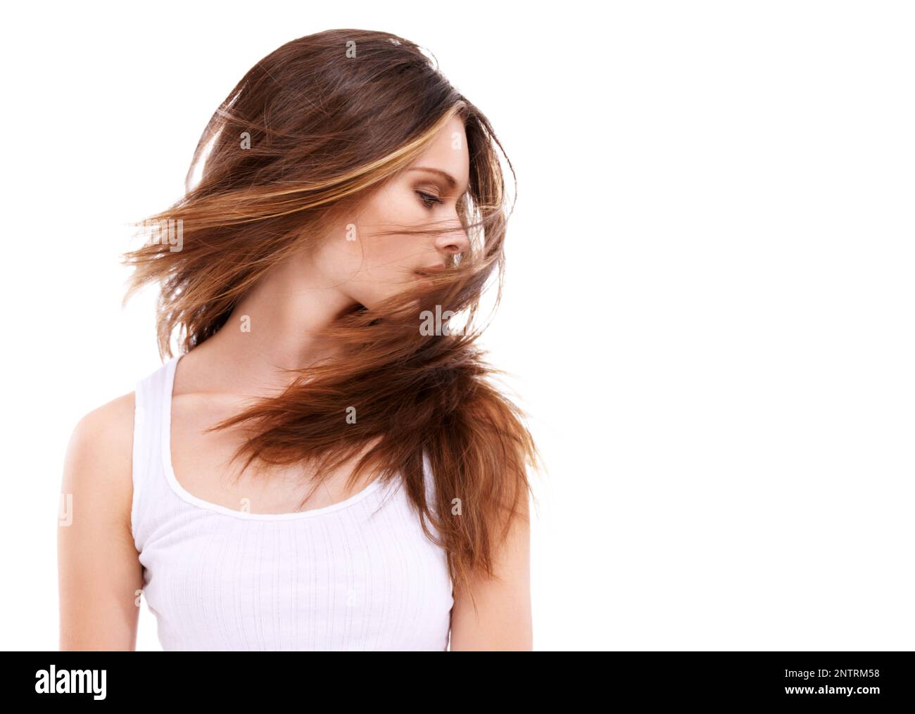 Her hair is filled with body and life. A beautiful young woman ...