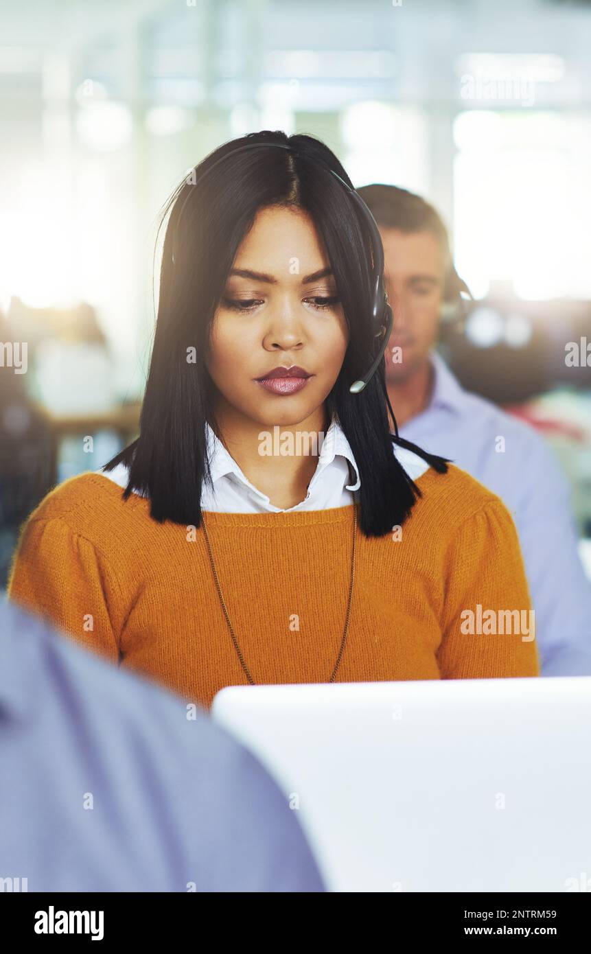 Working hard to help every caller. Cropped shot of people working in ...