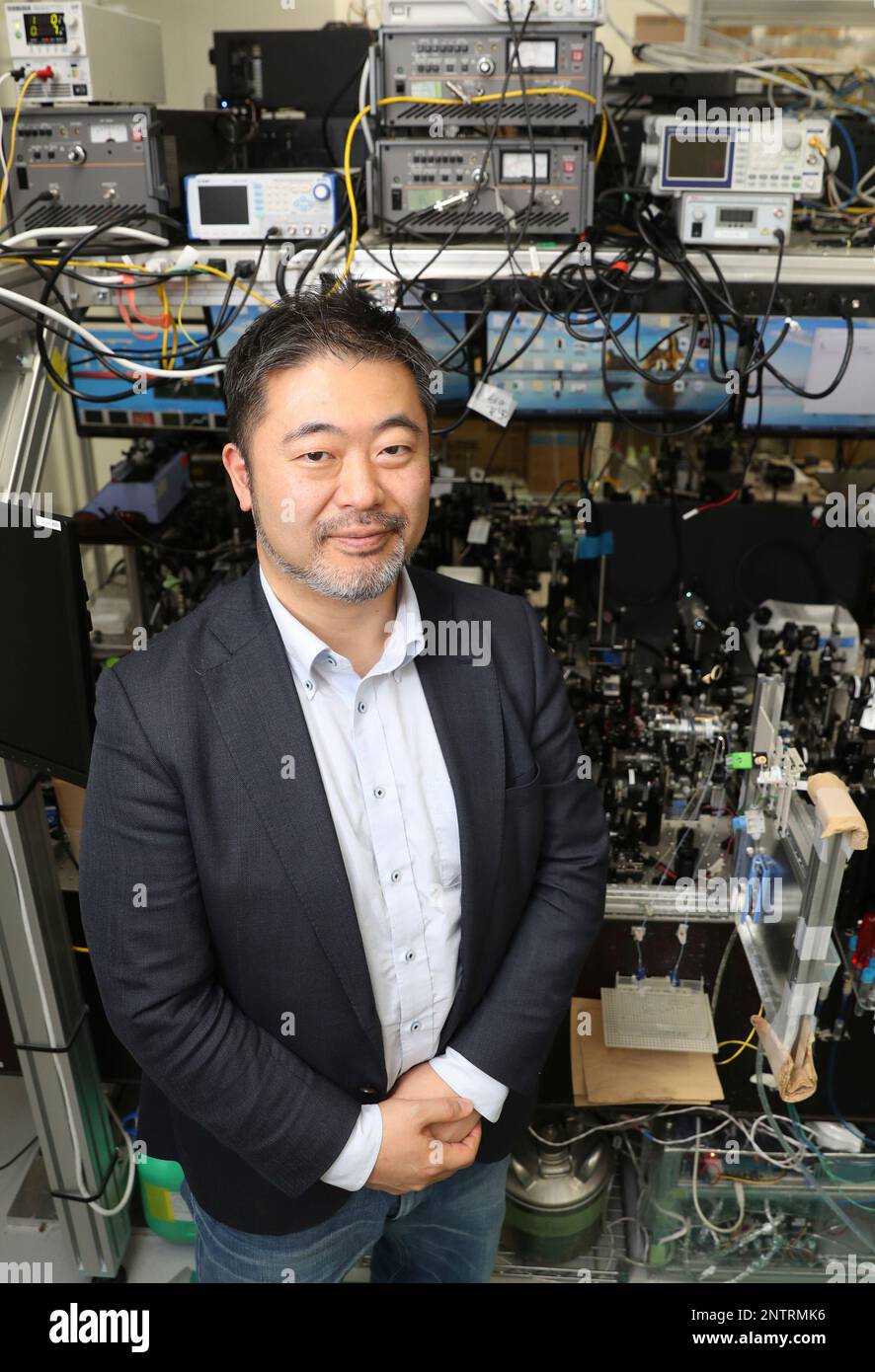 Keisuke Goda, a professor at University of Tokyo's department chemistry poses for a photographer ...