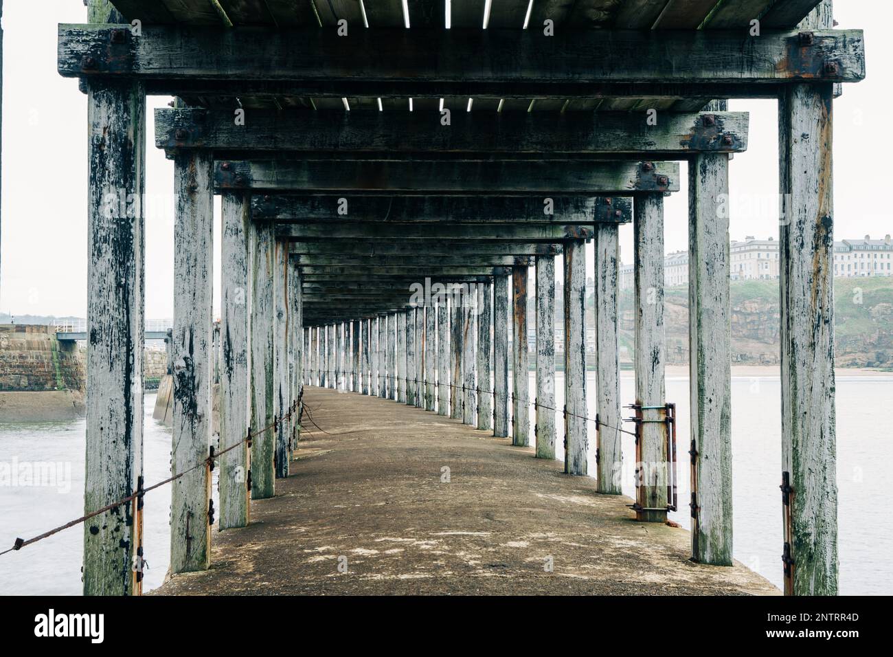 Whitby pier in the harbour and lighthouses to warn the ships and boats ...