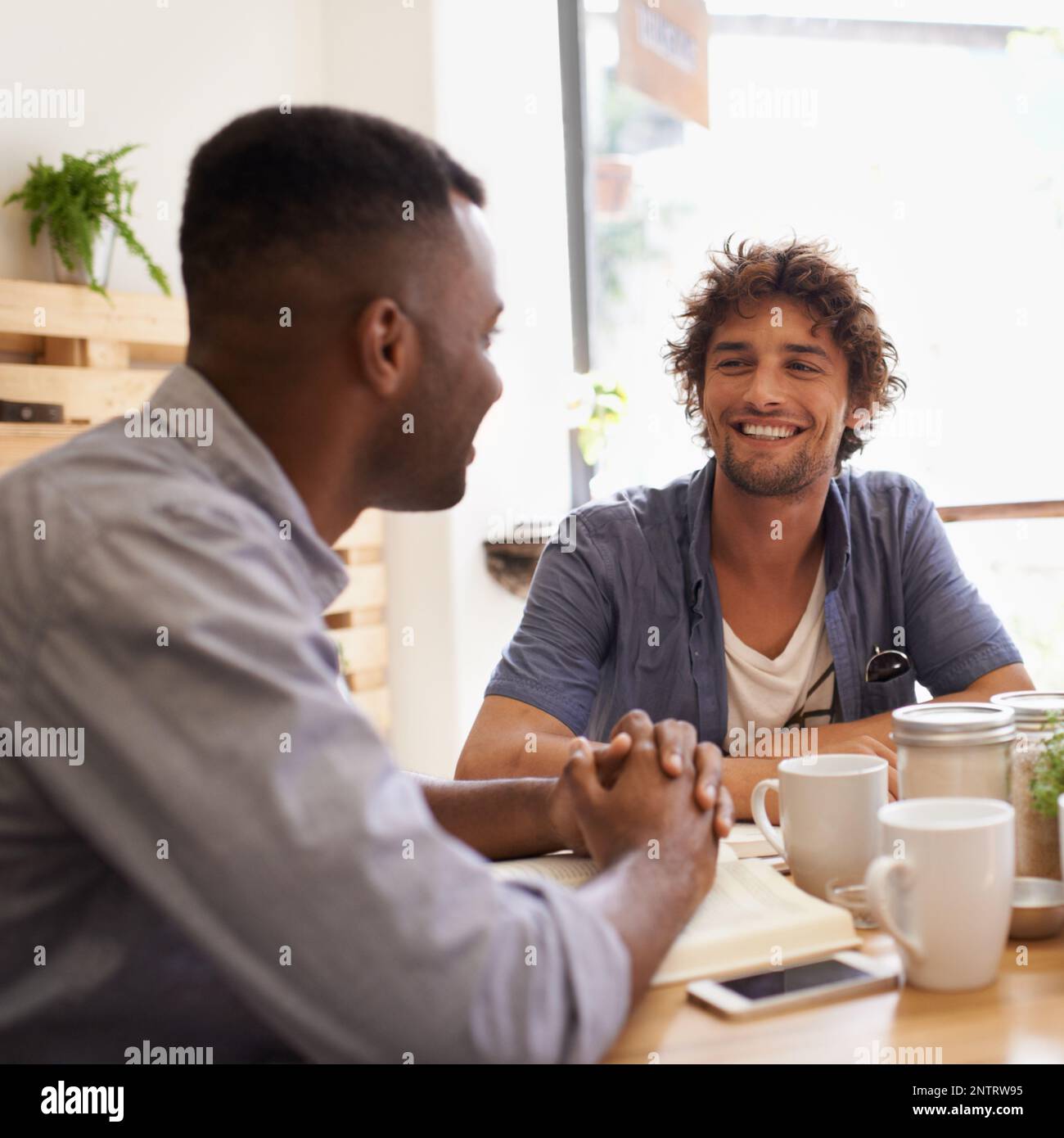 Dude, so how are you doing. Two young men having a conversation while ...