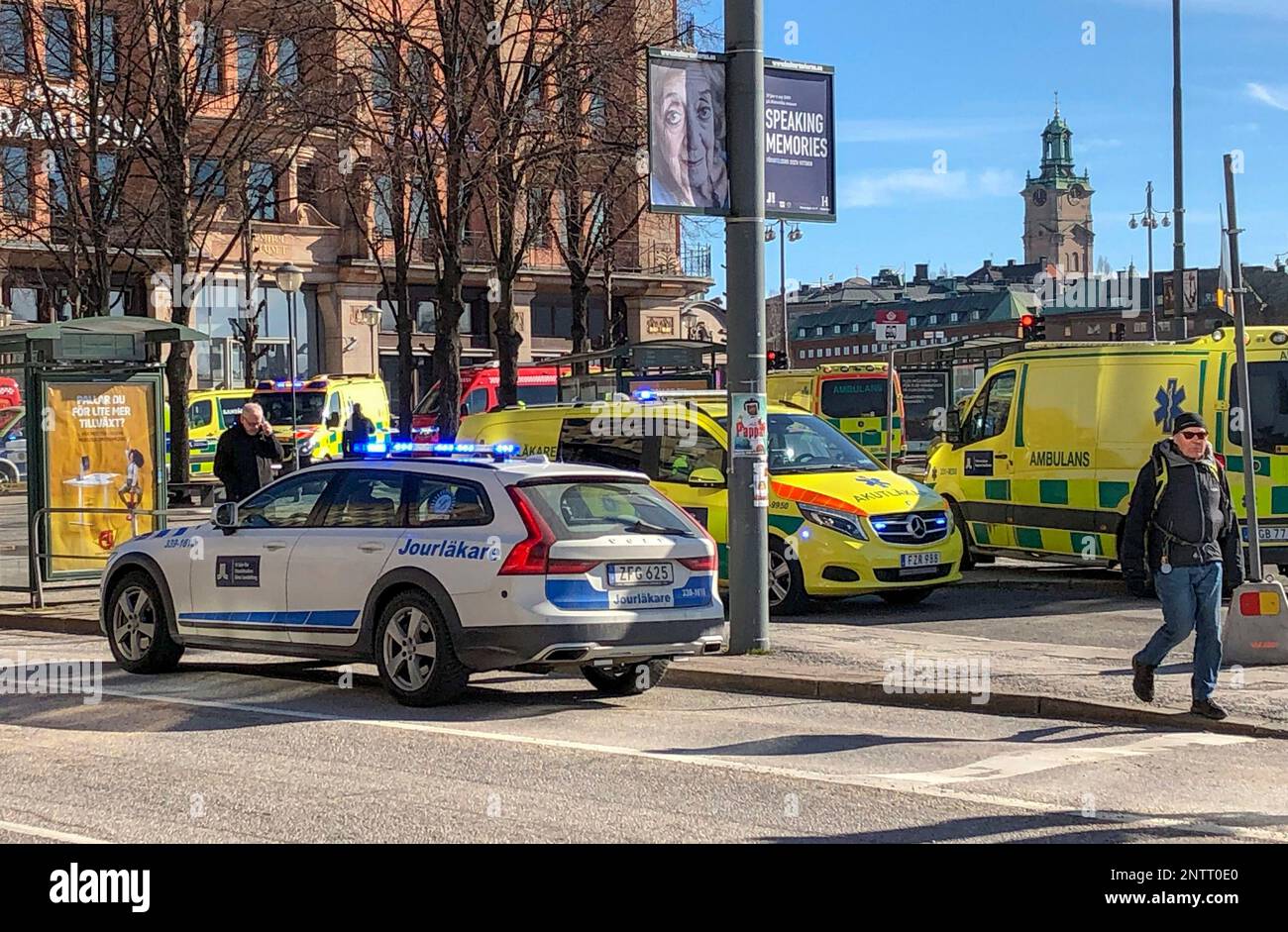Emergency service vehicles gather after a bus exploded and caught fire ...