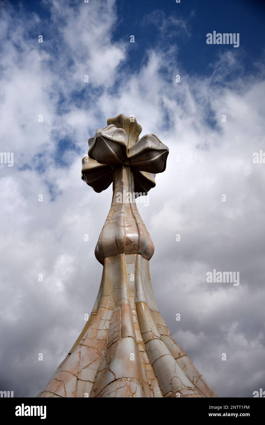 Amazing architecture of chimneys and cross on top of Barcelona ...