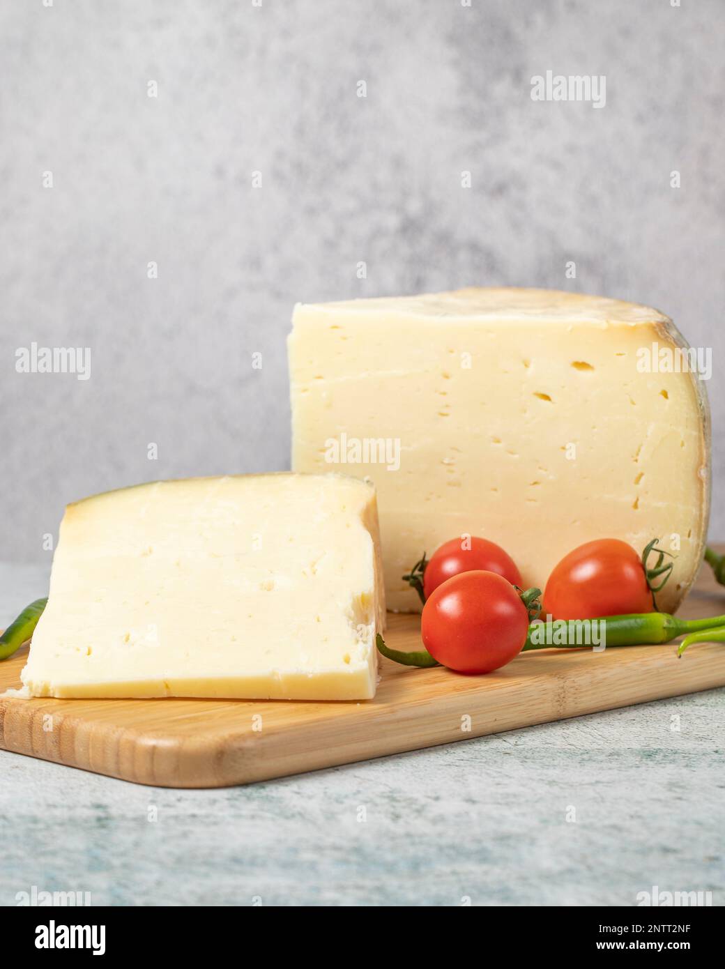 wheel cheese. Cheese made from cow's milk on a wooden flipchart ...