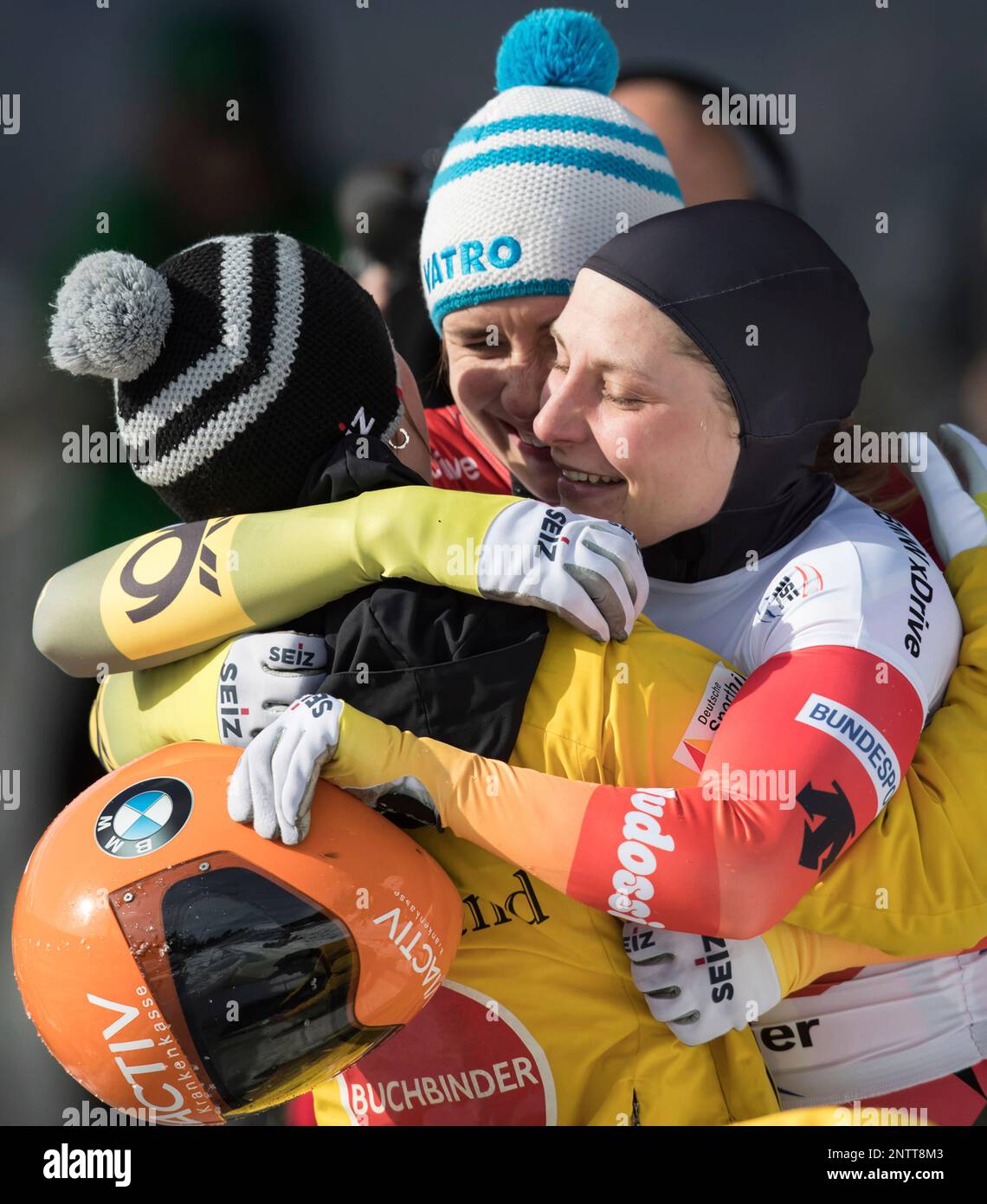 Germany's Tina Hermann, front right, who won, embraces compatriots ...