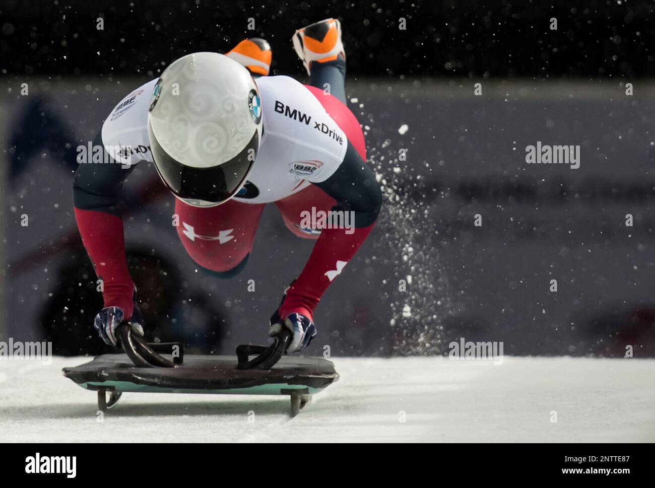Kendall Wesenberg, of the United States, jumps on her sled during the ...