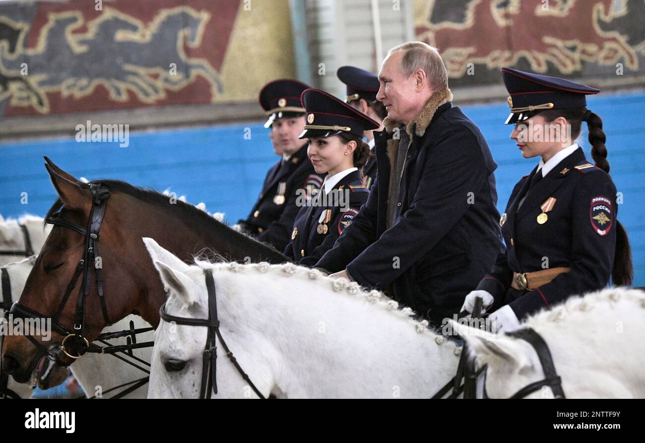 Russian President Vladimir Putin, second right, rides a horse on a ...
