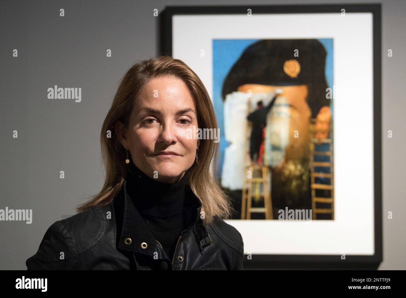 US photographer Carolyn Cole stands in front of one of her pictures at ...