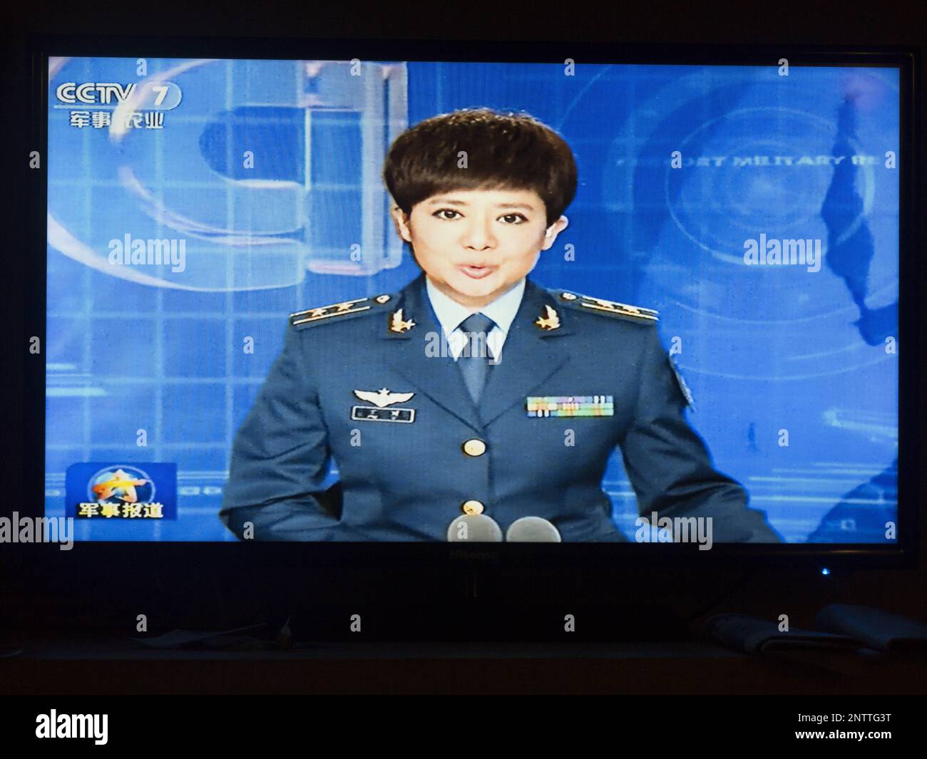 Military TV news anchor on Chinese TV Stock Photo - Alamy