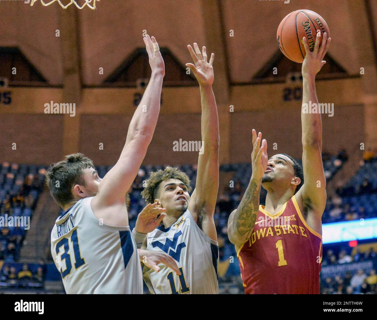 Iowa State guard Nick Weiler-Babb (1) shoots over West Virginia forward ...