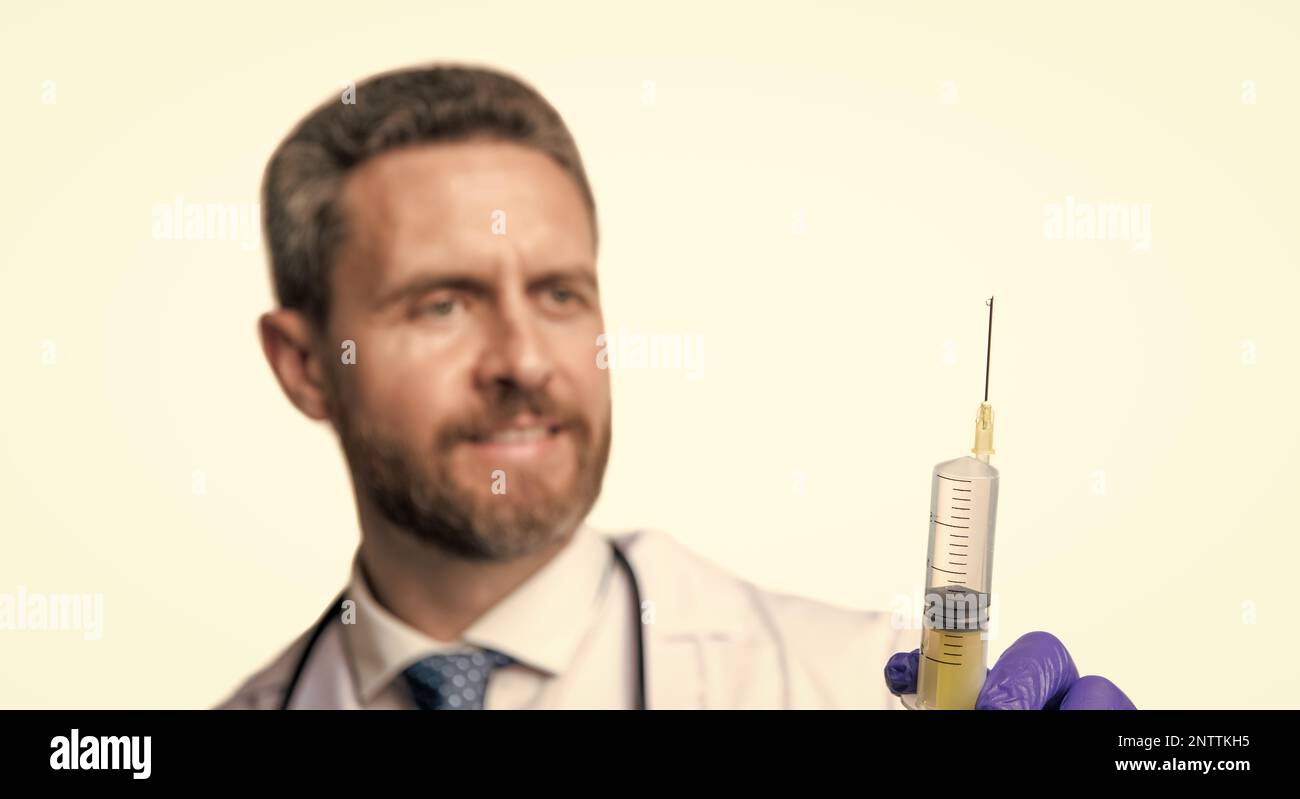 Plastic syringe with needle selective focus. Medical doctor holding ...