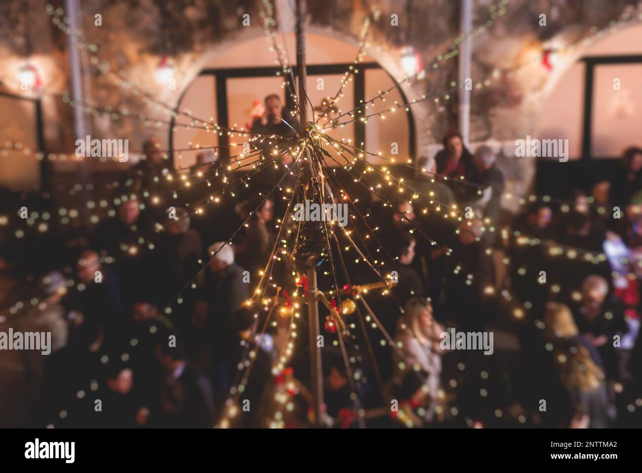 Crowded Christmas market fair with a New Year decorations, balloons ...
