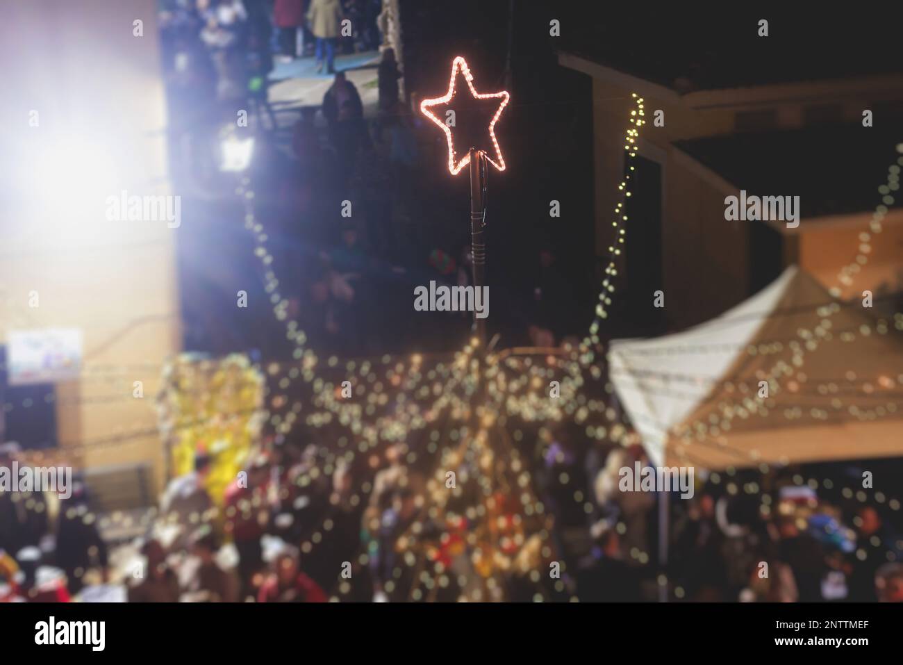 Crowded Christmas market fair with a New Year decorations, balloons ...