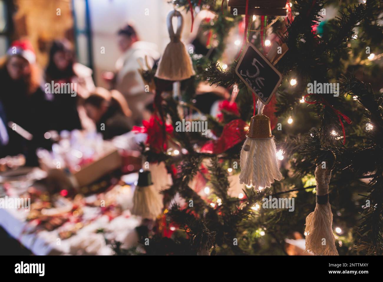 Crowded Christmas market fair with a New Year decorations, balloons ...