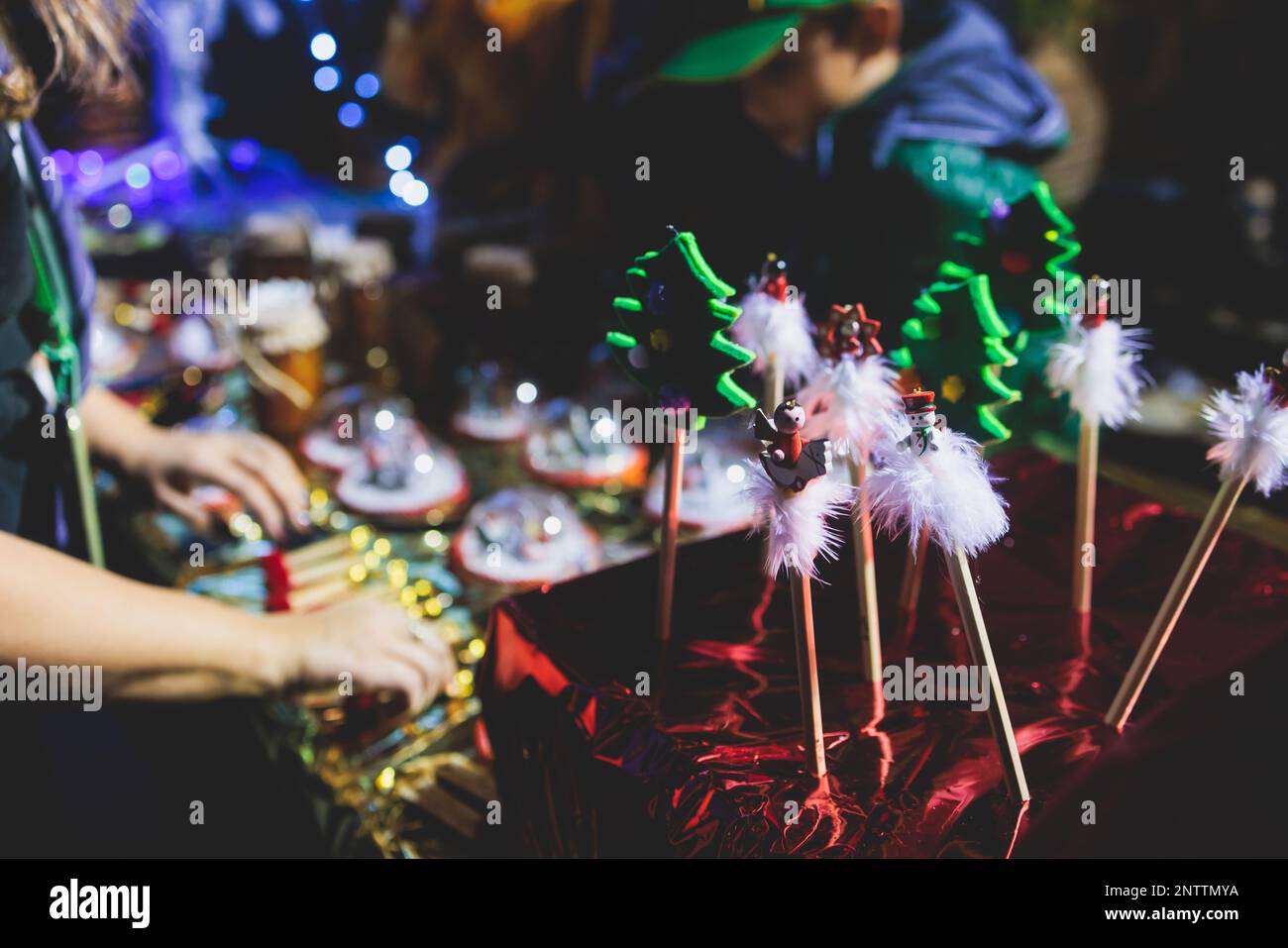 Crowded Christmas market fair with a New Year decorations, balloons ...