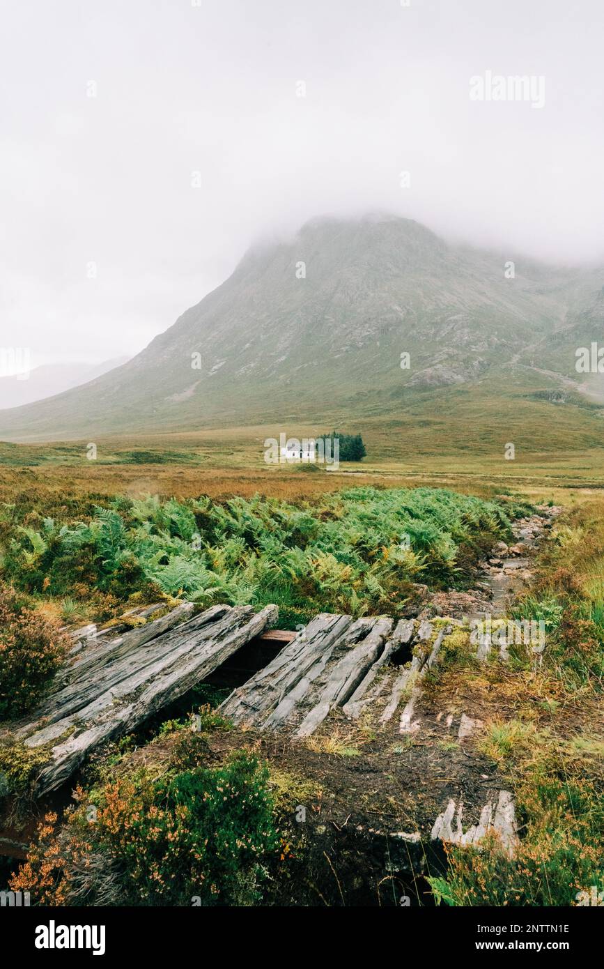 Bridge with river and mountains in the background. In Glencoe in the ...