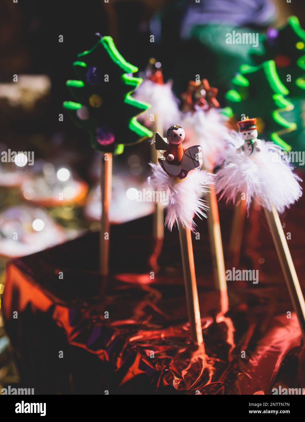 Crowded Christmas market fair with a New Year decorations, balloons ...
