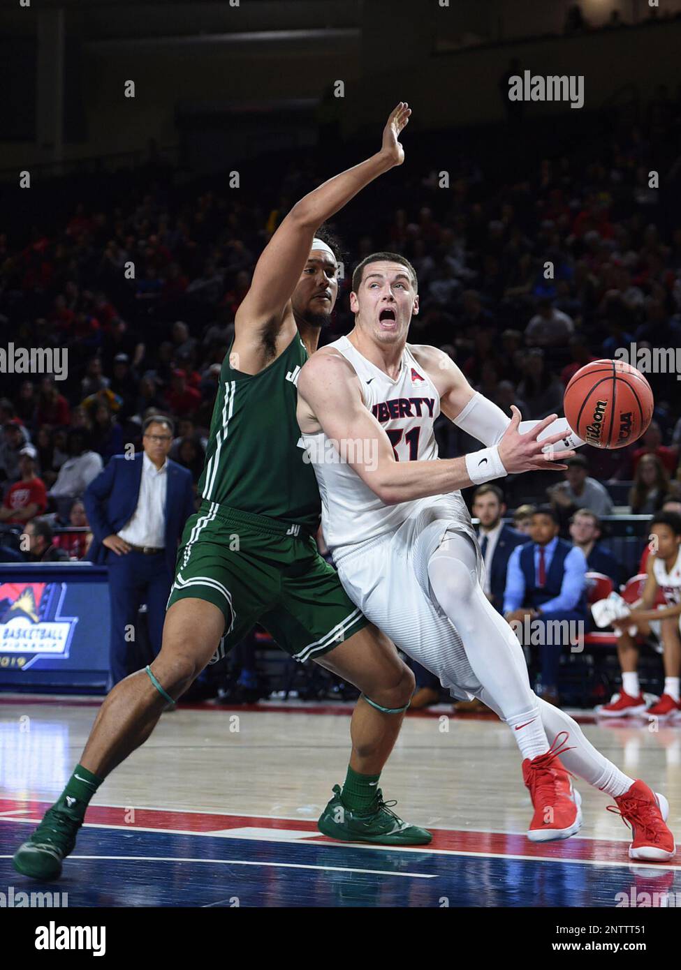 Liberty forward Scottie James goes for a layup against Jacksonville ...