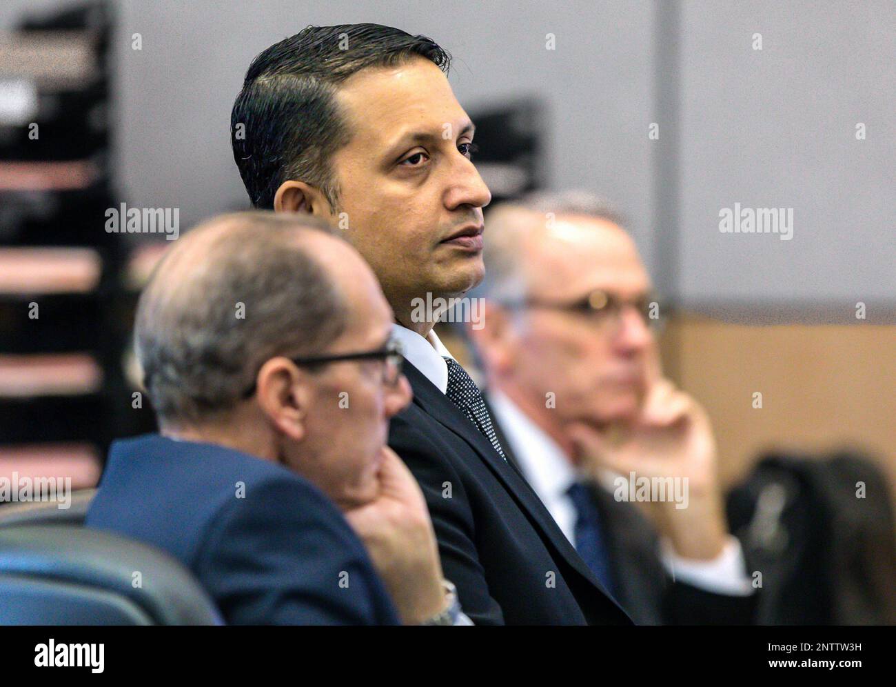 Nouman Raja sits with defense attorneys Richard Lubin, left, and Scott ...