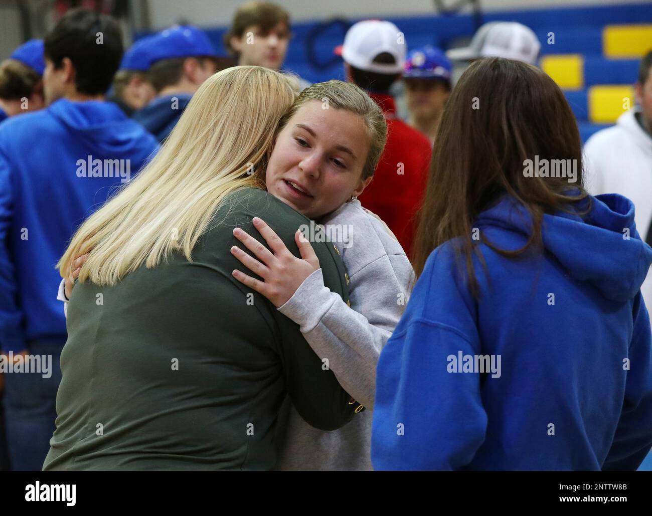 Cheyenne Dean, center, and Leslie Melson console each other as students ...