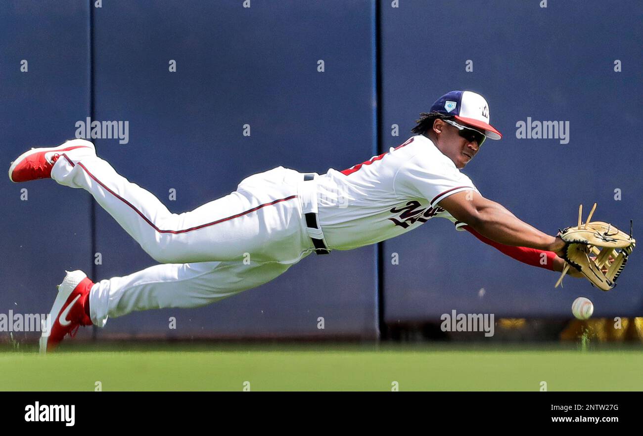 Washington Nationals right fielder Chuck Taylor dives but is unable to ...